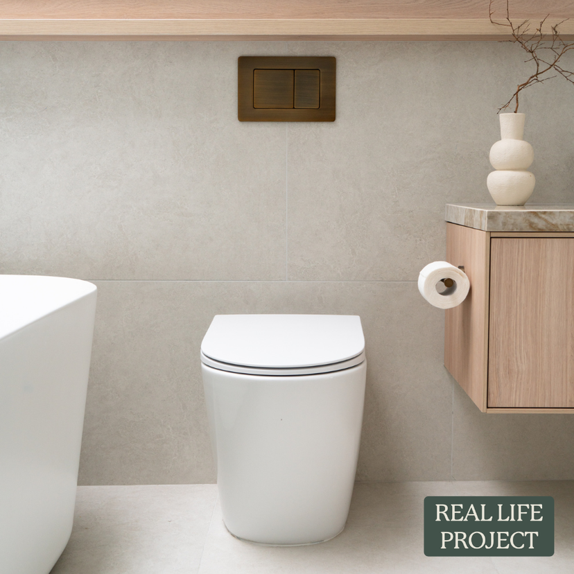 Angled In-Wall Toilet With Rectangle Antique Brass Buttons | Yabby