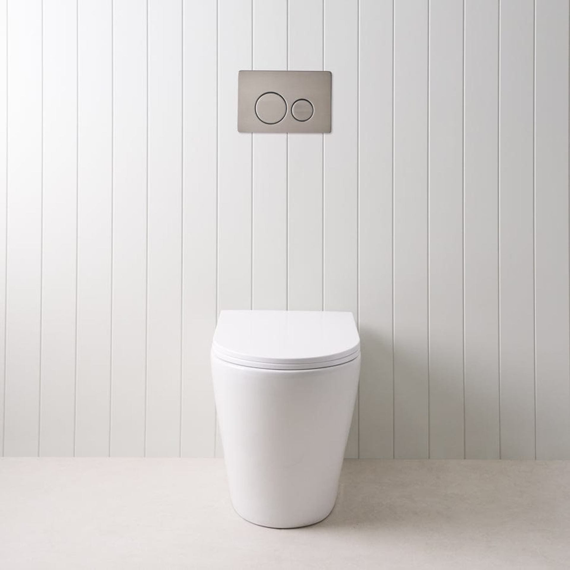 Angled In-Wall Toilet With Round Gunmetal Buttons | TileCloud