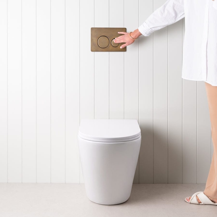 Angled In-Wall Toilet With Round Antique Brass Buttons | TileCloud