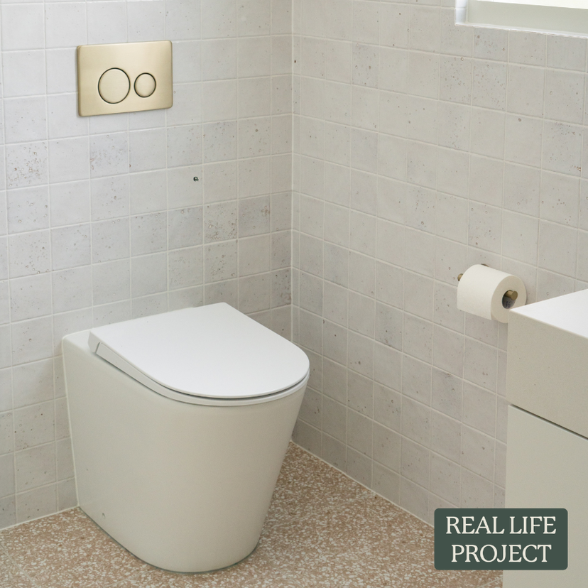 Angled In-Wall Toilet With Round Warm Brushed Nickel Buttons | Yabby