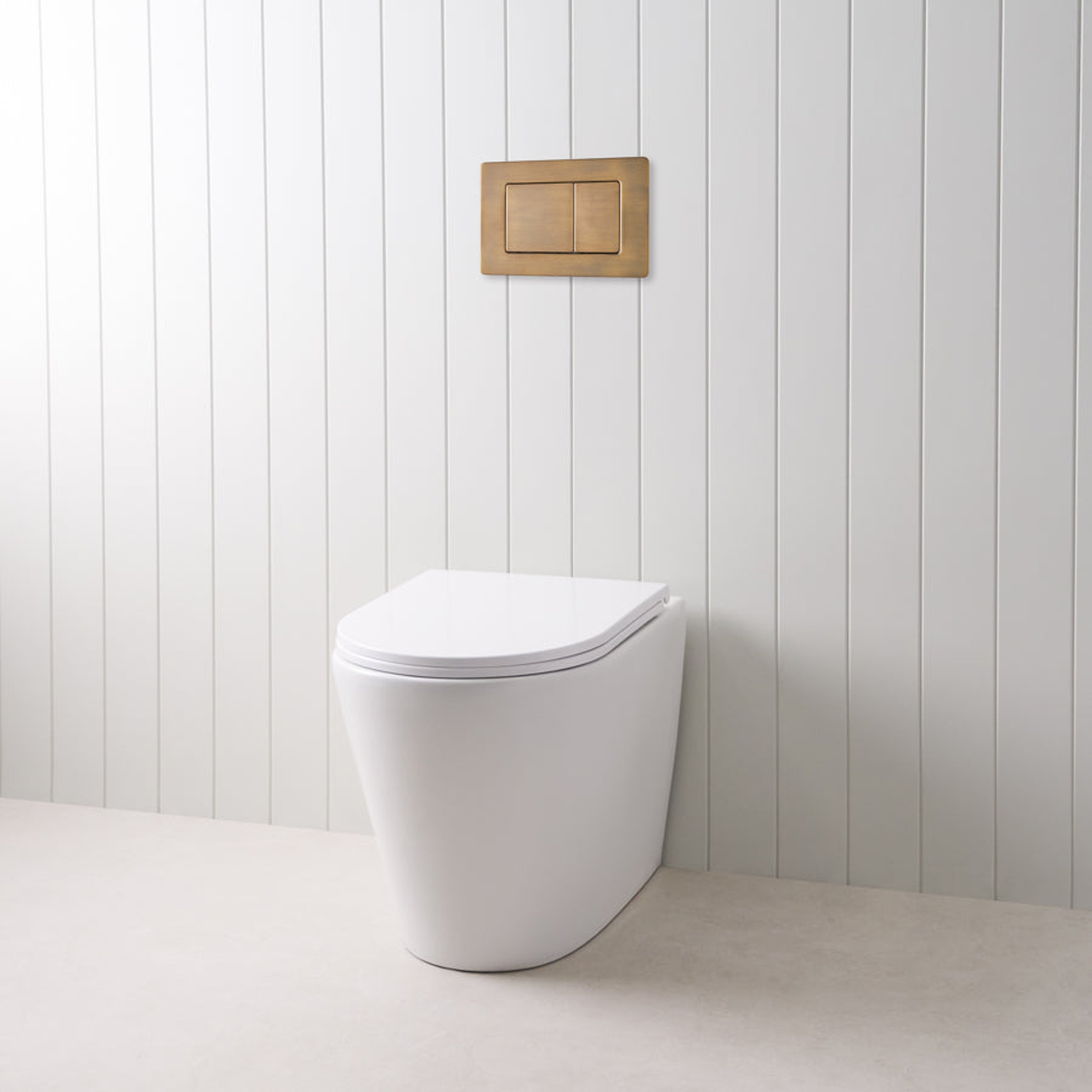 Angled In-Wall Toilet With Rectangle Antique Brass Buttons | Yabby