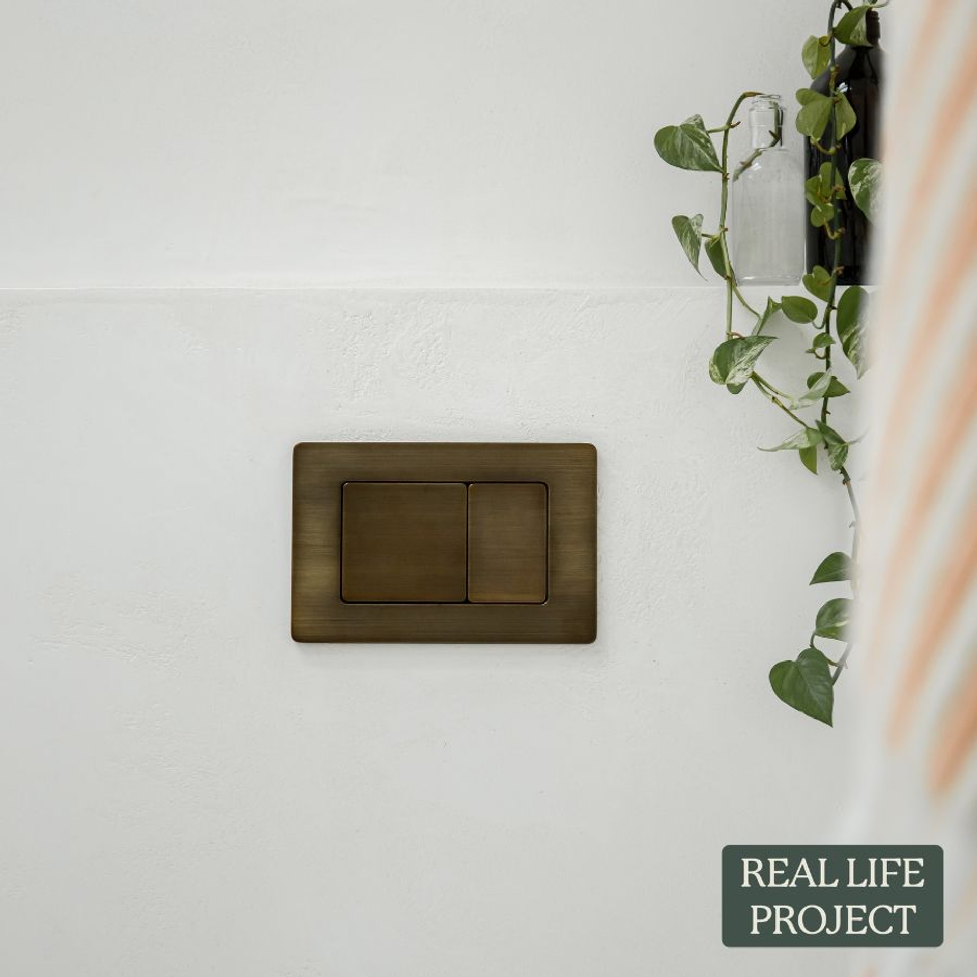 Angled In-Wall Toilet With Rectangle Antique Brass Buttons | Yabby