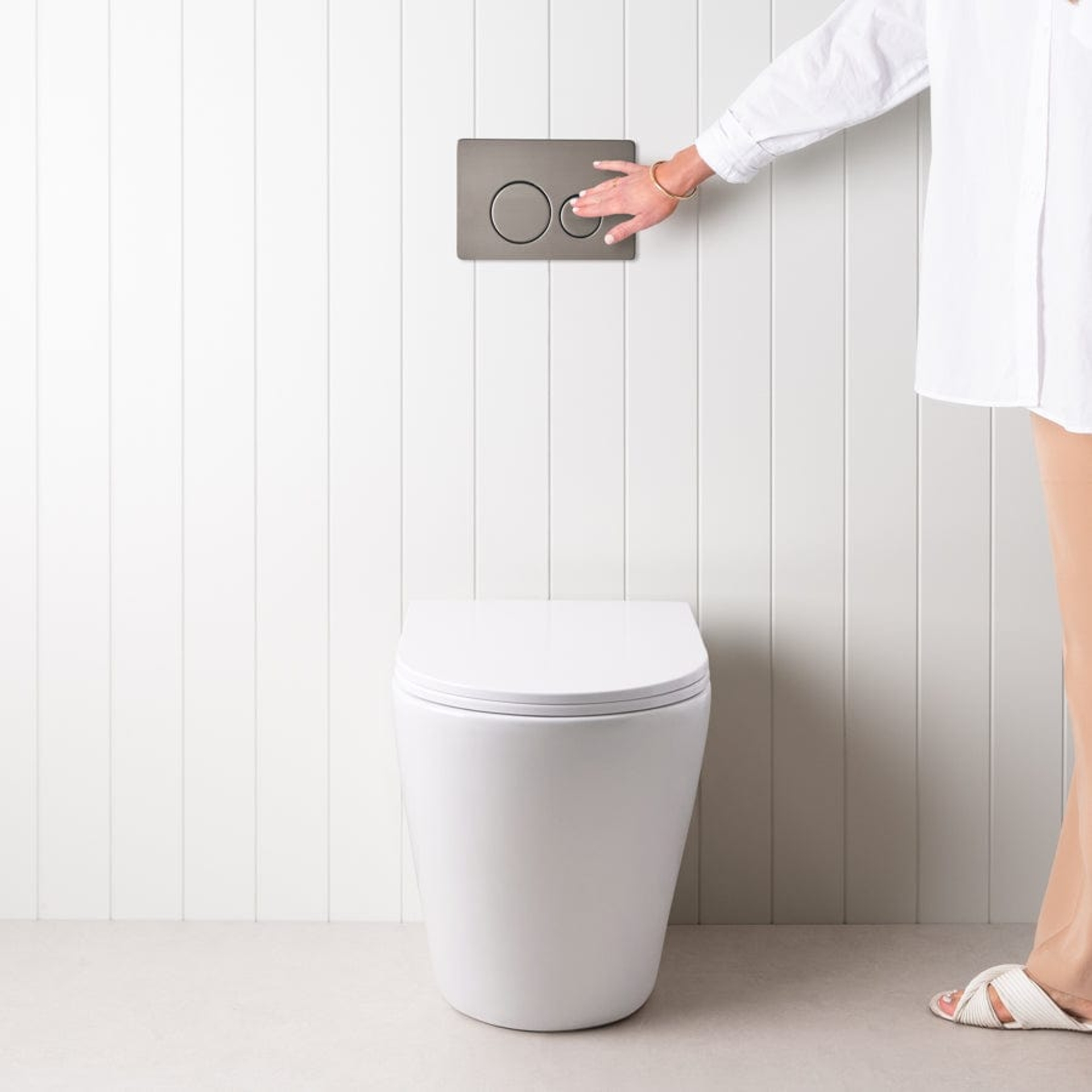 Angled In-Wall Toilet With Round Gunmetal Buttons | Yabby