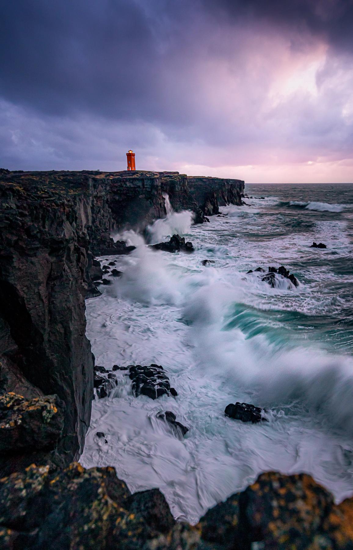 Guide to Svörtuloft Lighthouse: An Orange Beacon on Black Cliffs