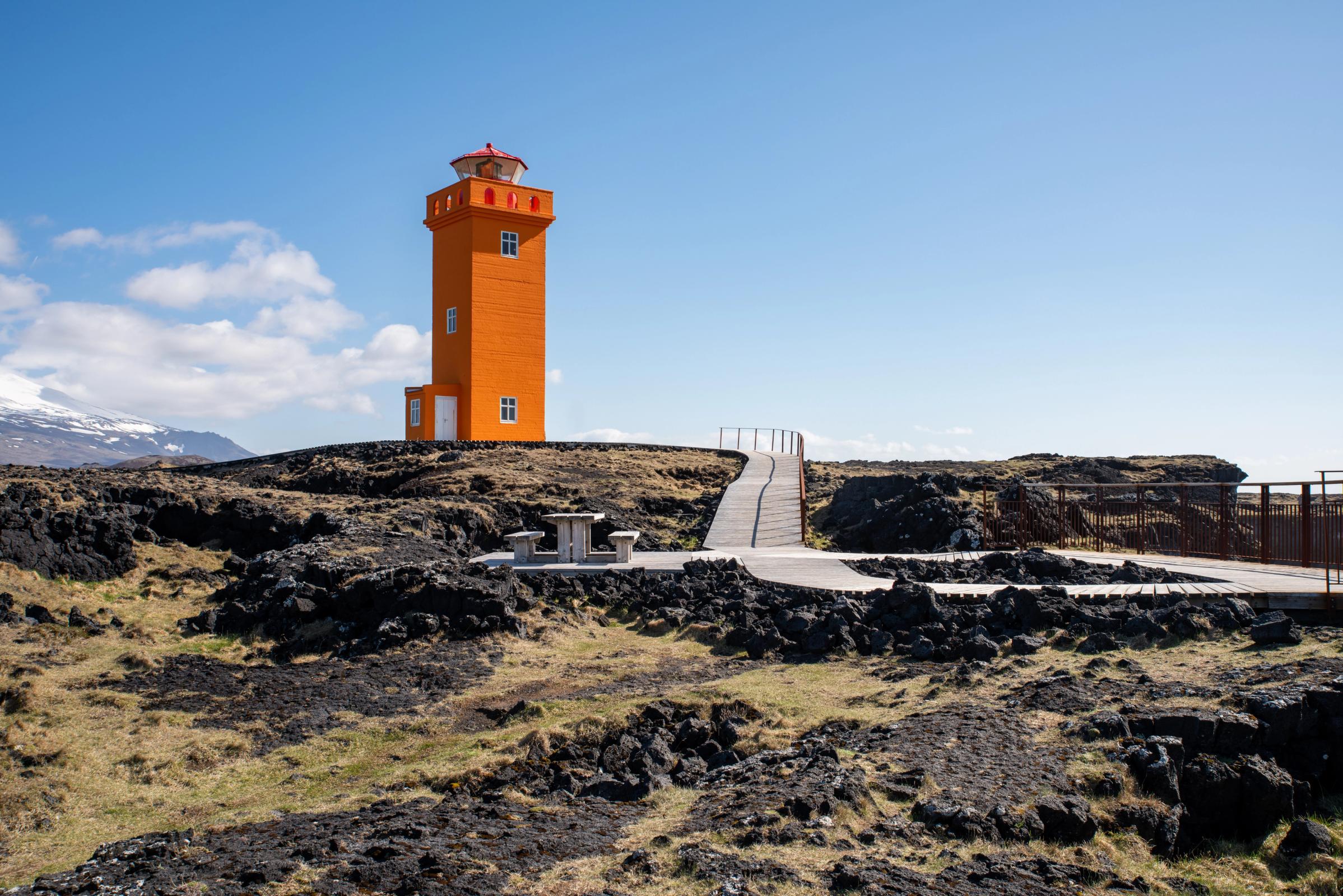 Guide to Svörtuloft Lighthouse: An Orange Beacon on Black Cliffs