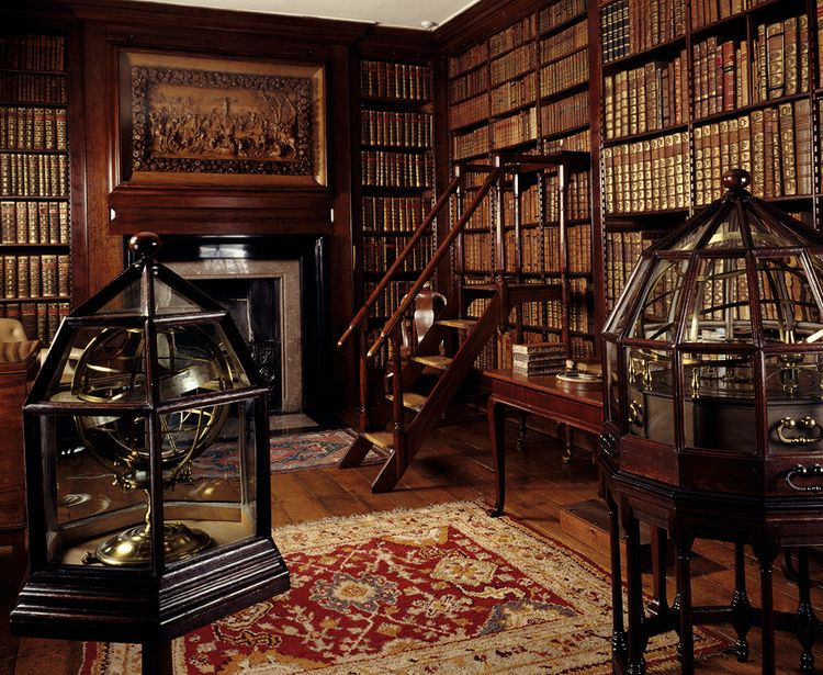 What was the real purpose of the English country house library?