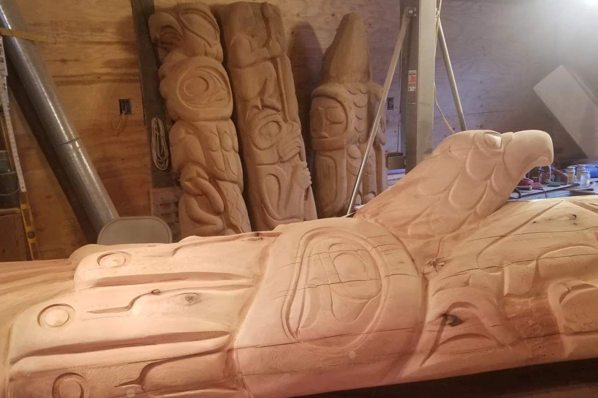 Lummi artists create a totem pole to call attention to the need to ...