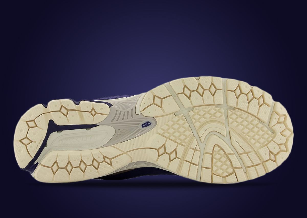 This New Balance 2002R Comes In A Navy Cream Mix