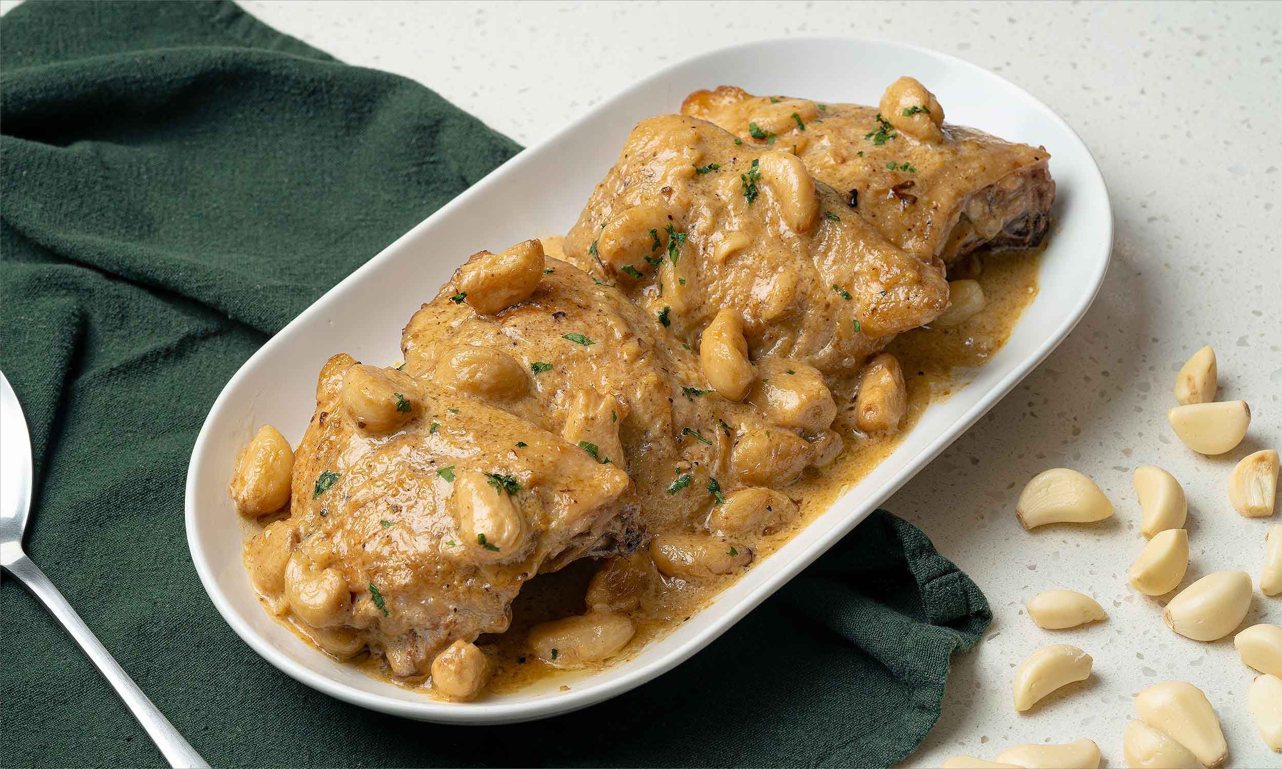 Creamy Chicken Thighs with 50 Cloves of Garlic Recipe | Pepper.ph
