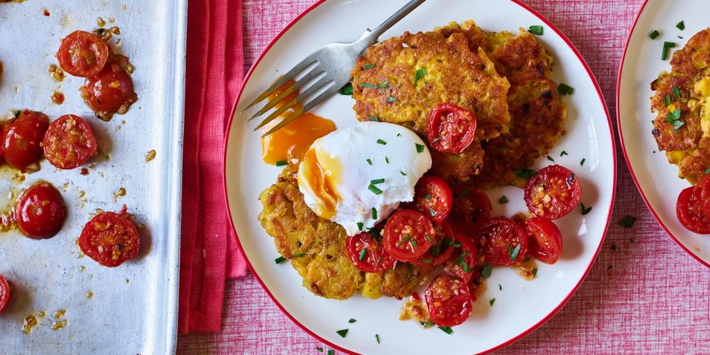 Corn cakes with poached eggs & spicy roast tomatoes - LEON