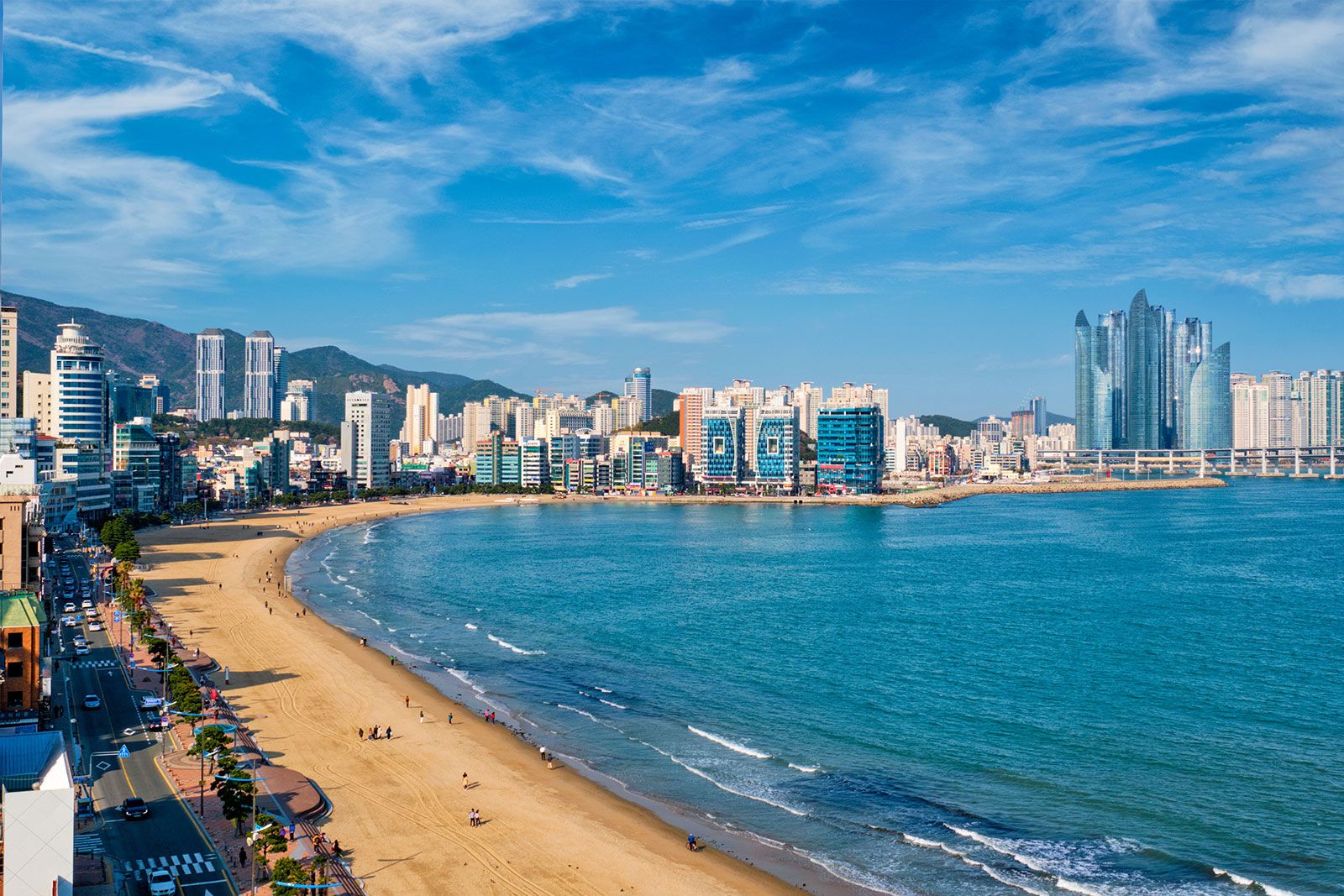 A landscape view of a city beach coastline.