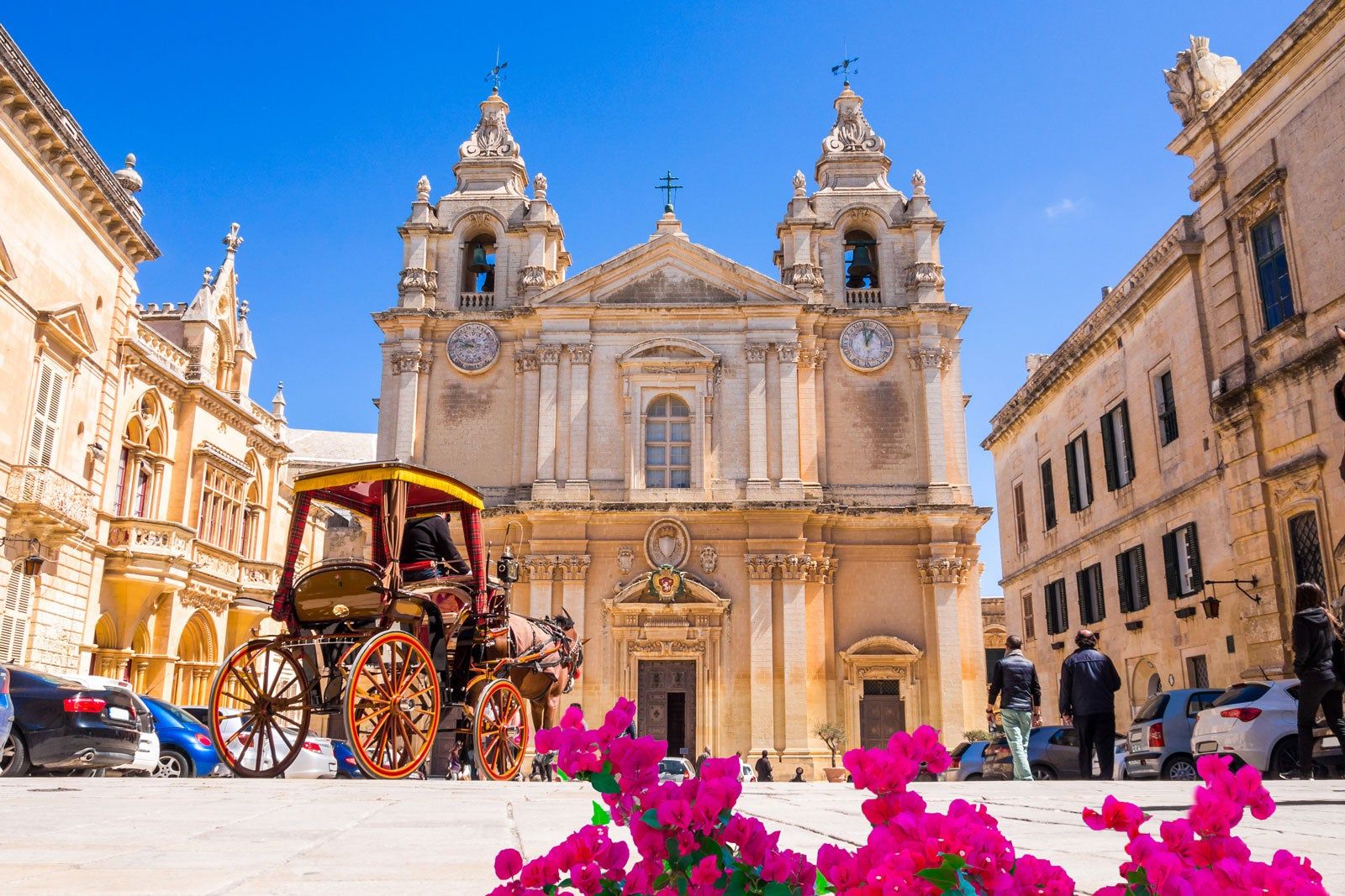 Palace with a horse drawn wagon. 