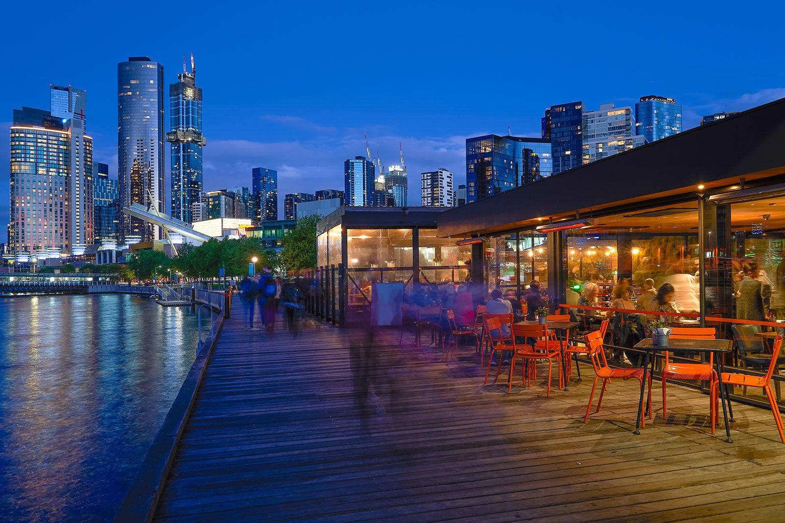 Restaurants on a boardwalk in Melbourne.
