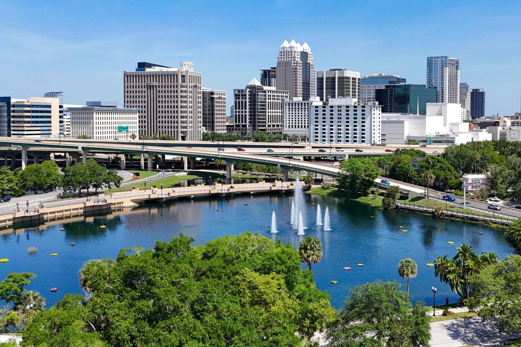View looking over a lake and the downtown skyline.