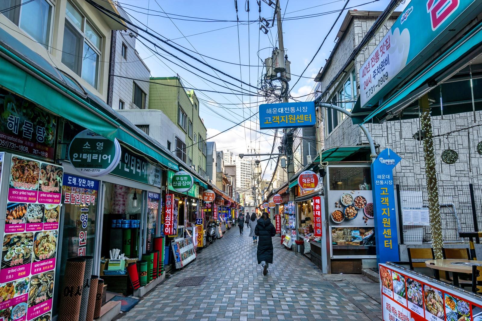 Walkway between store front restaurants.