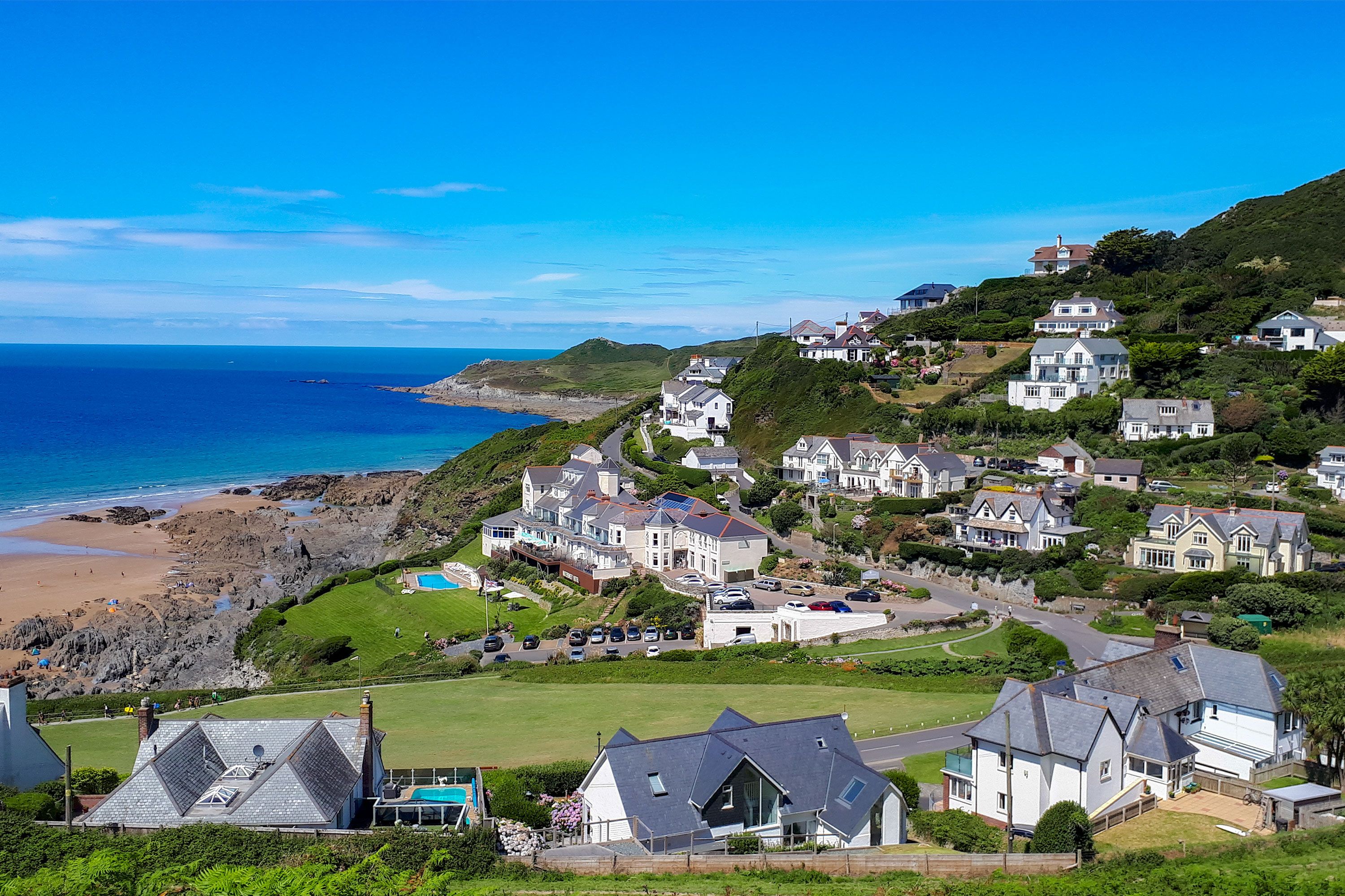 A coastal view of homes along a cliffside.