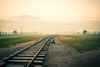 A railroad and fences in a memorial and museum.