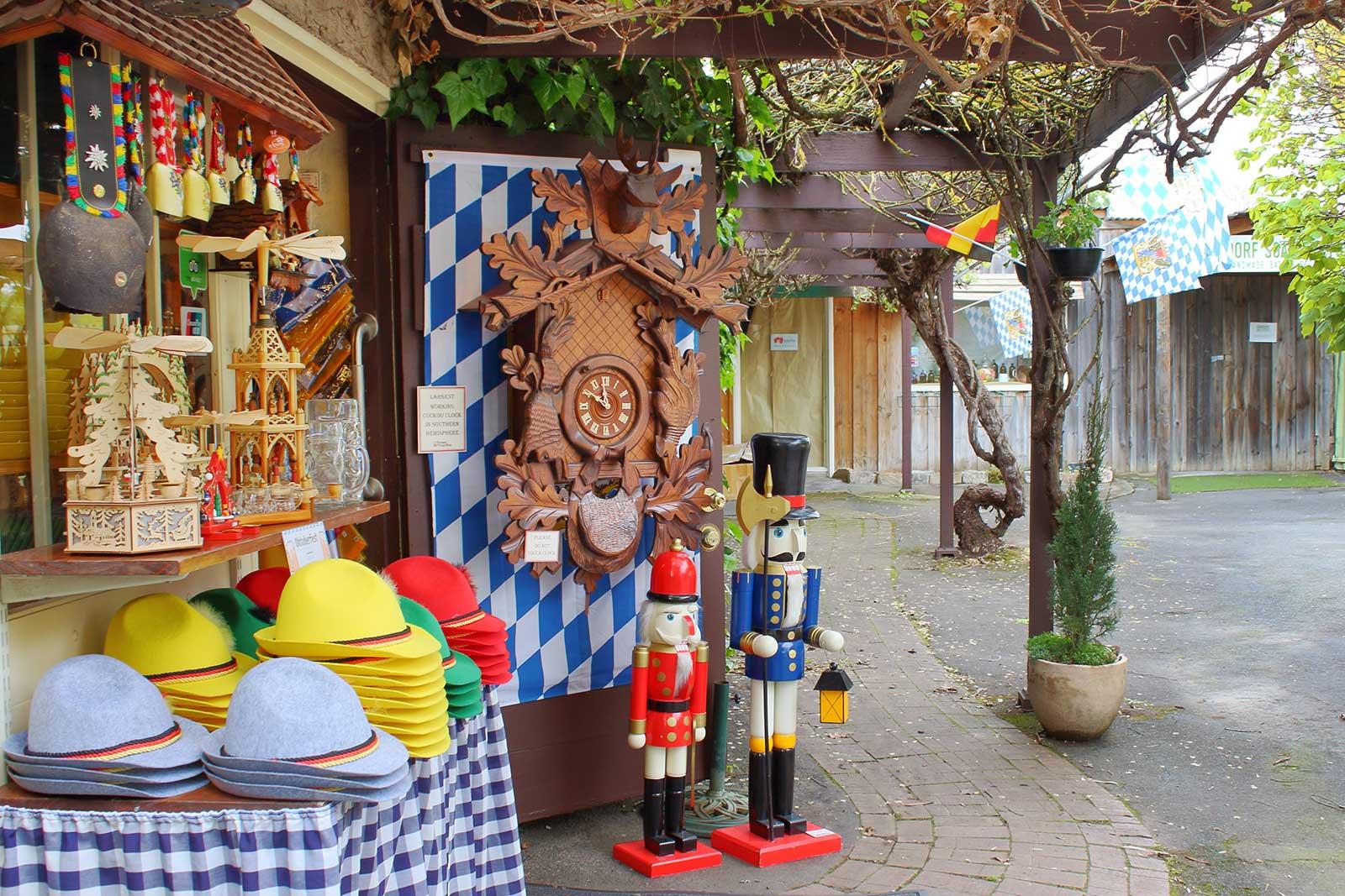 Traditional hats and wooden toys for sale on the street.