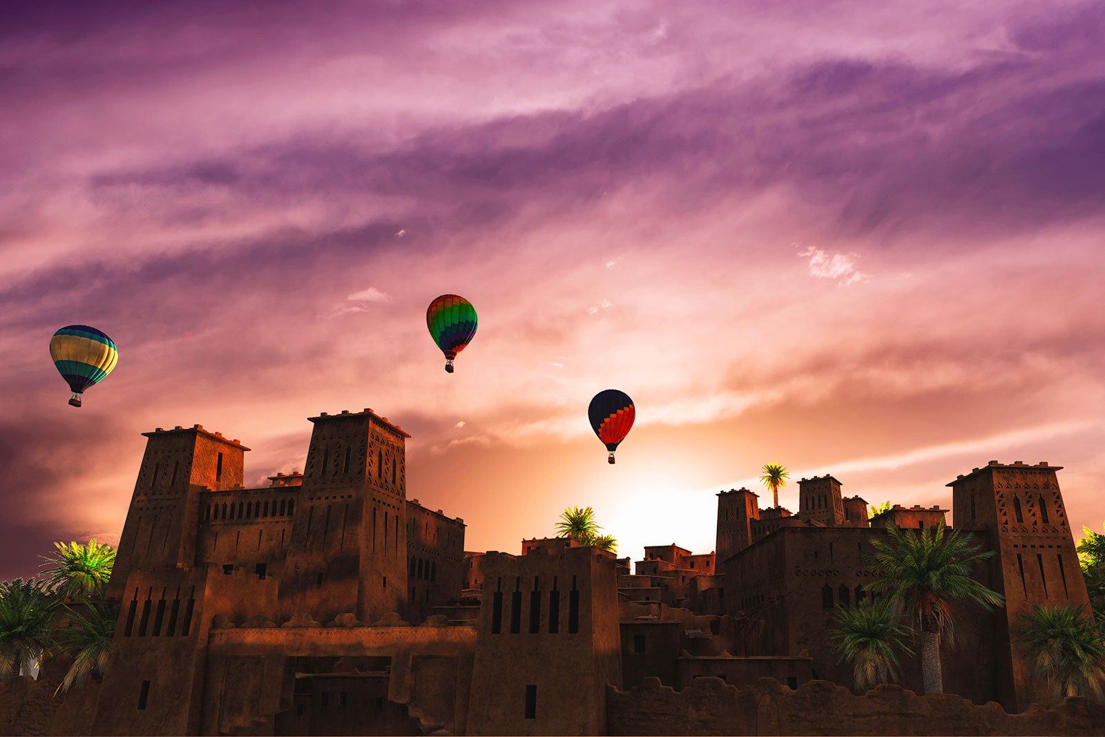 Hot air balloons in the sky over a traditional Moroccan building.