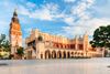An old town and hall in with an empty market square.