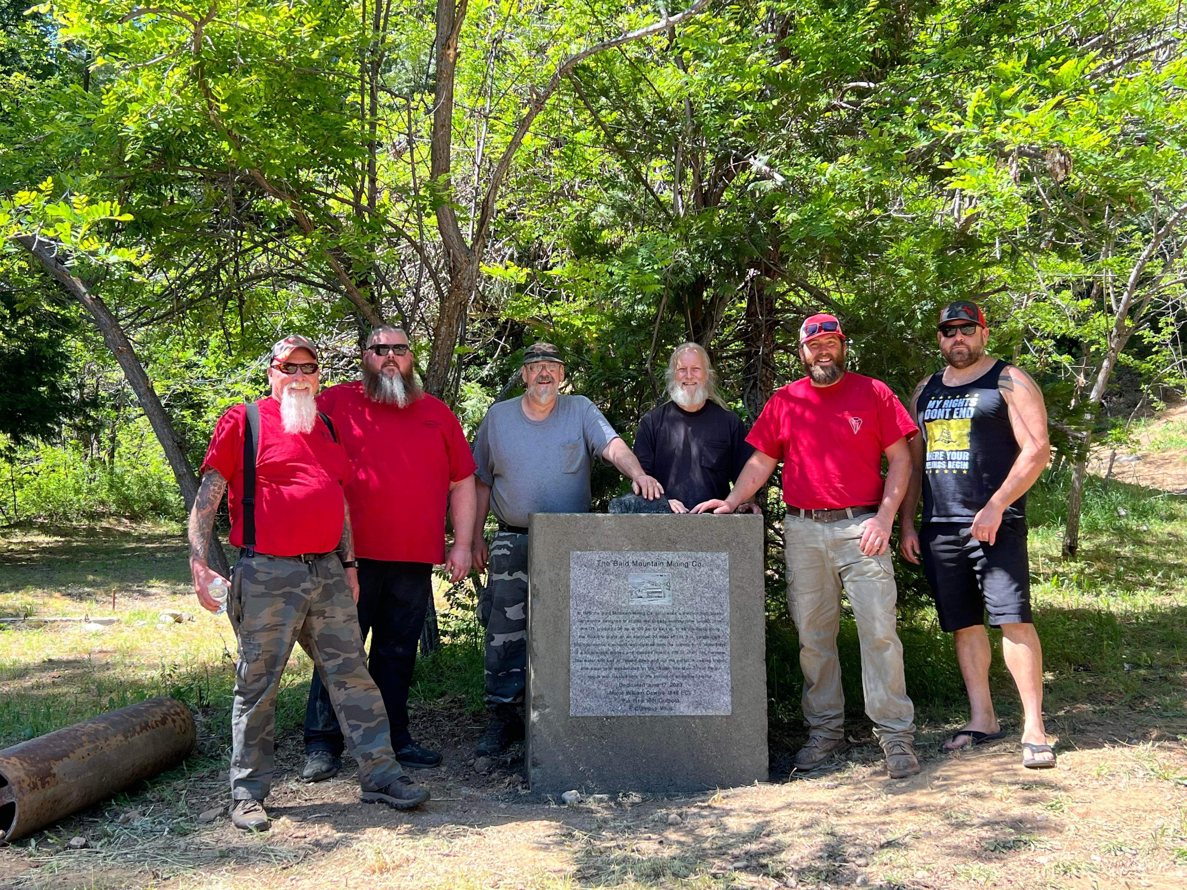 Clampers Install Plaque in Forest City