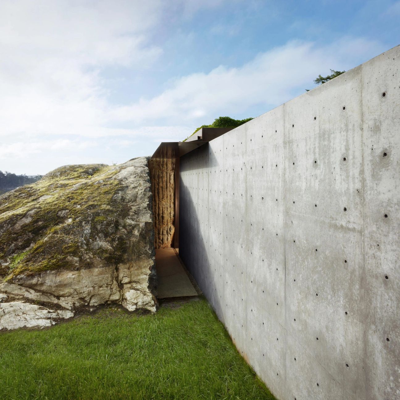 This modern home is carved into the rockface of the Washington ...