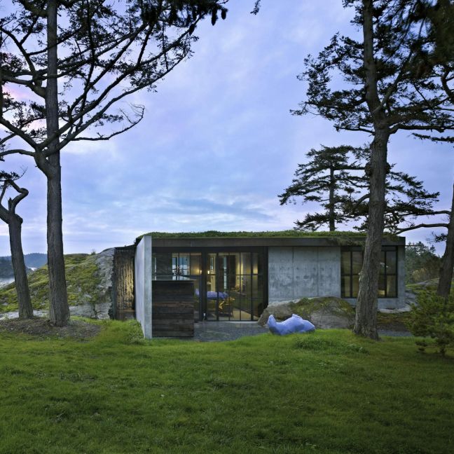 This modern home is carved into the rockface of the Washington ...