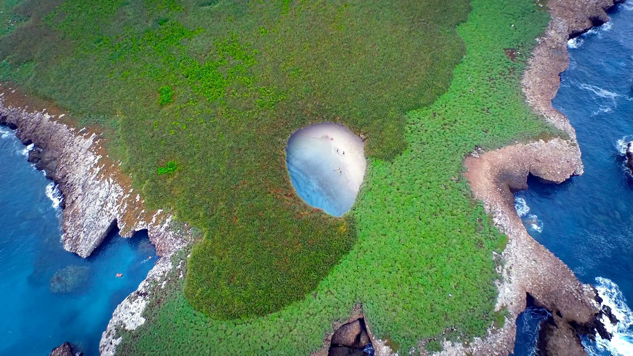 Aerial view of Hidden Beach in Marietas Islands, a secluded sandy cove ...