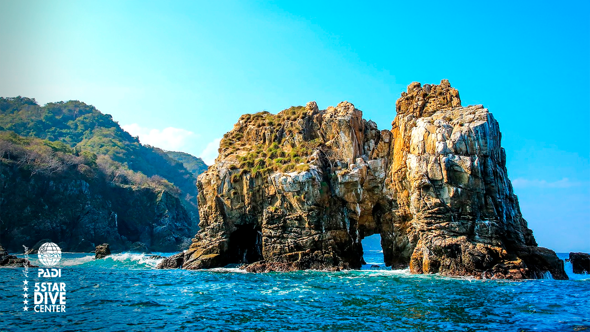 Las Iglesias rock formations rise from the ocean near Chimo, an ...