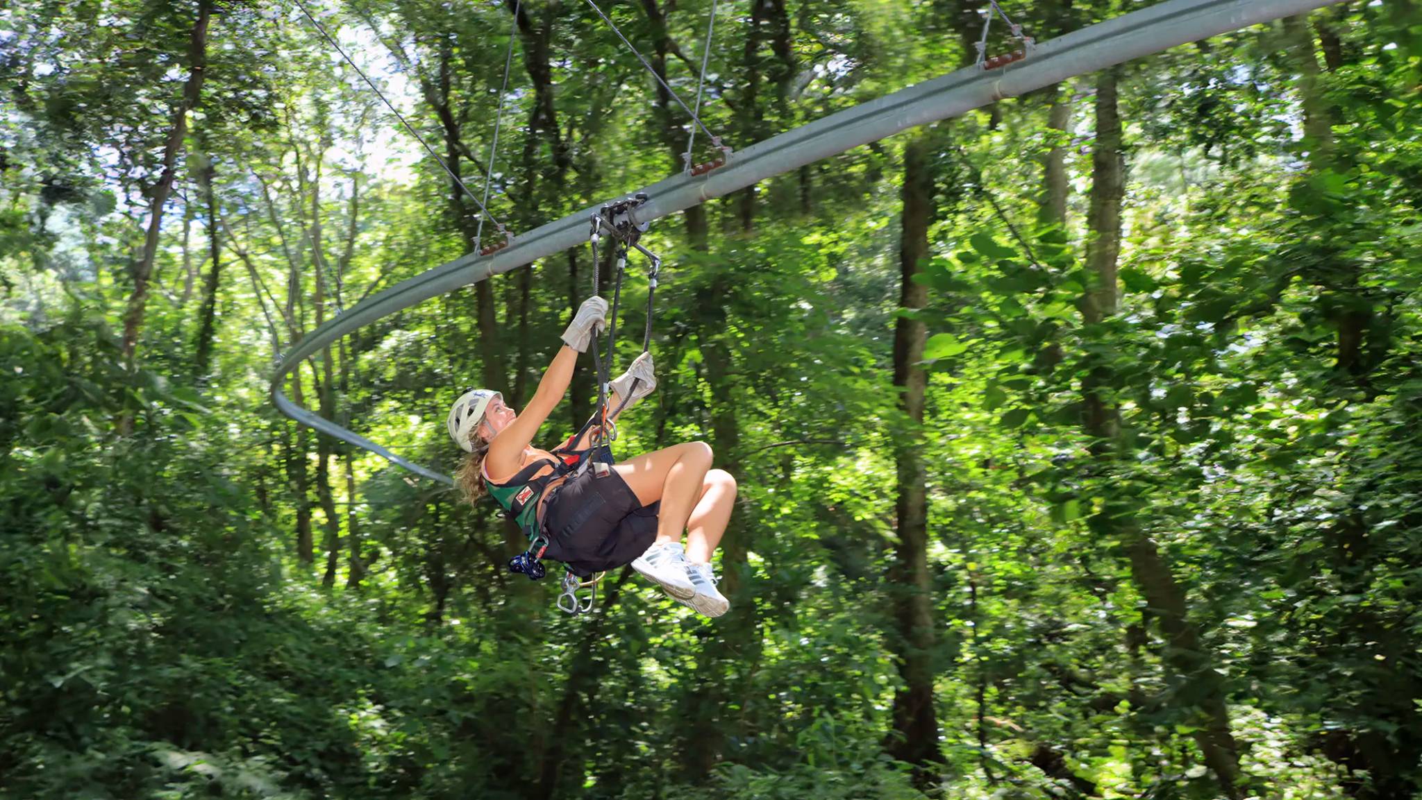 Woman sliding on the exciting Roller Coaster Zipline, exclusive to ...