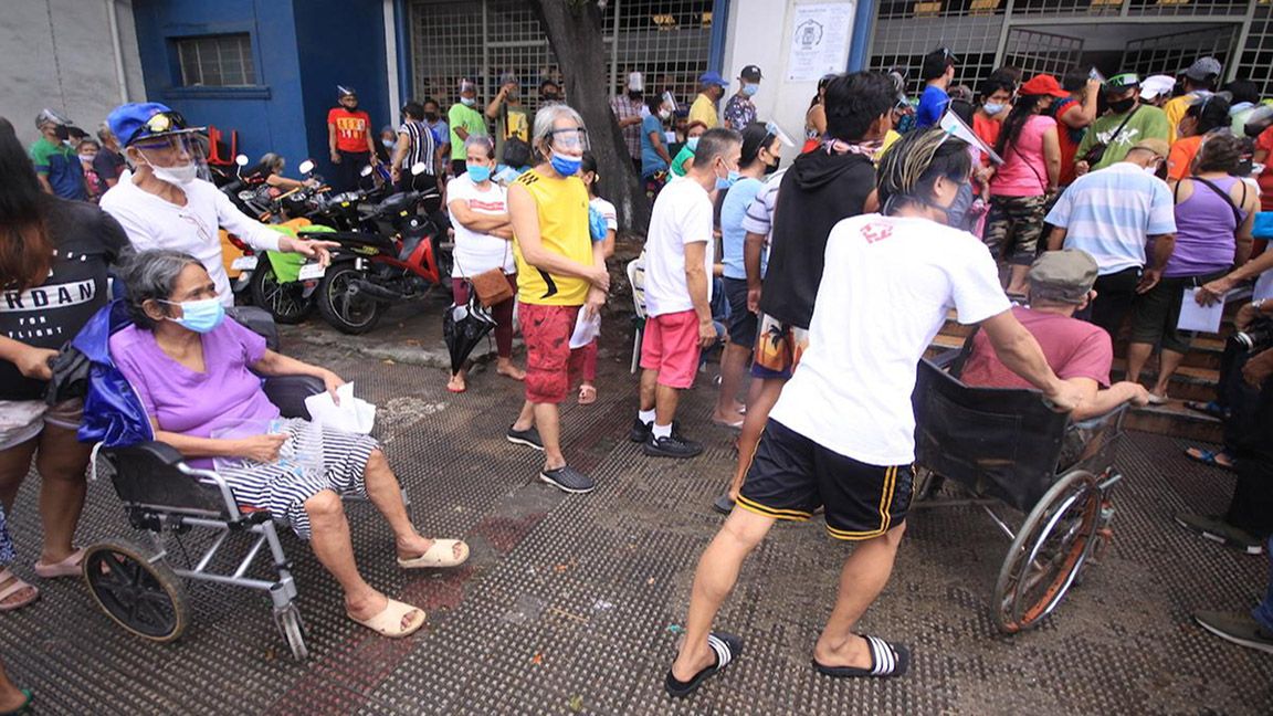 Elderly people given a hard time? Manila LGU probes ‘chaotic’ ayuda ...